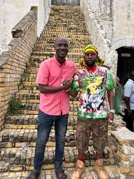 Popcaan Pays Emotional Tribute to Ancestors During Visit to Cape Coast ...